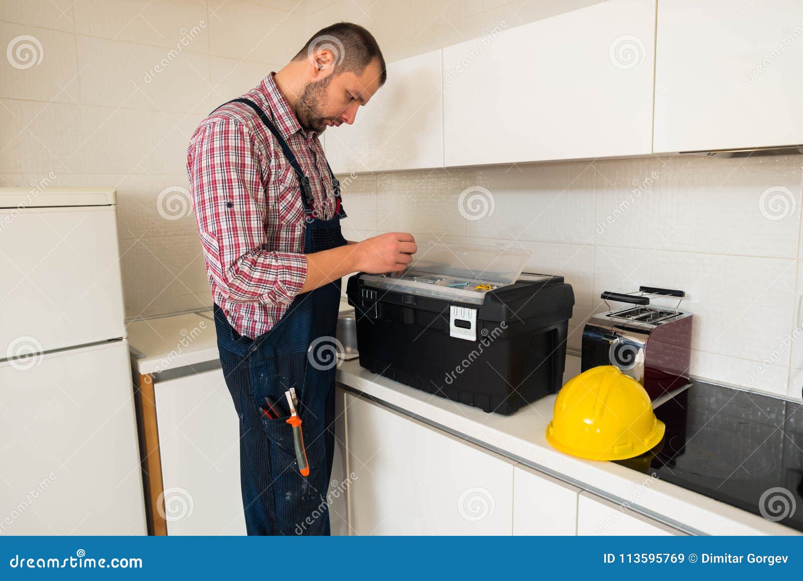 Handyman with Tools and a Hard Hat in the Kitchen Stock Image - Image ...