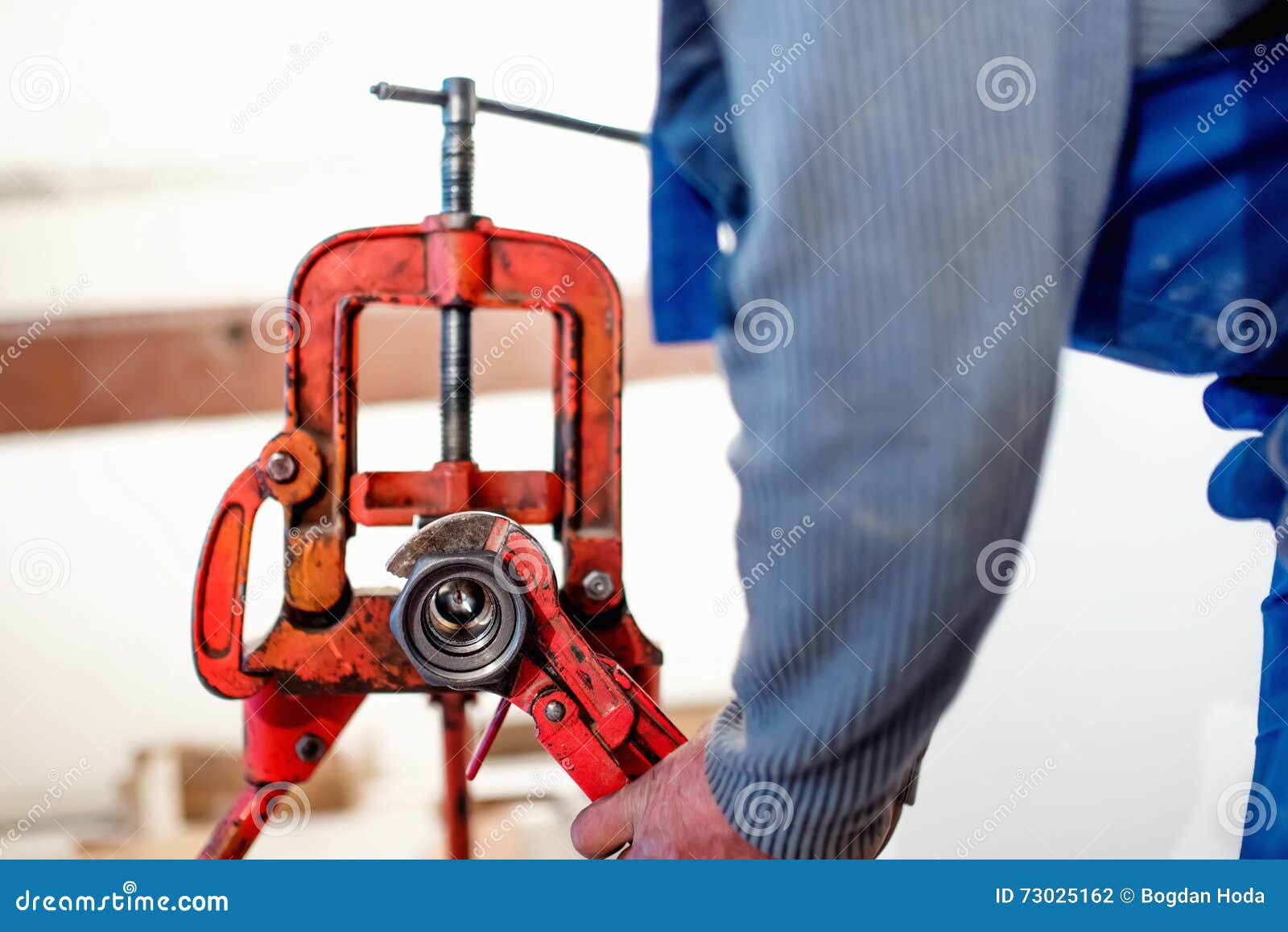 Handyman Using Wrench at Industrial Plumbing, Construction Site Stock ...
