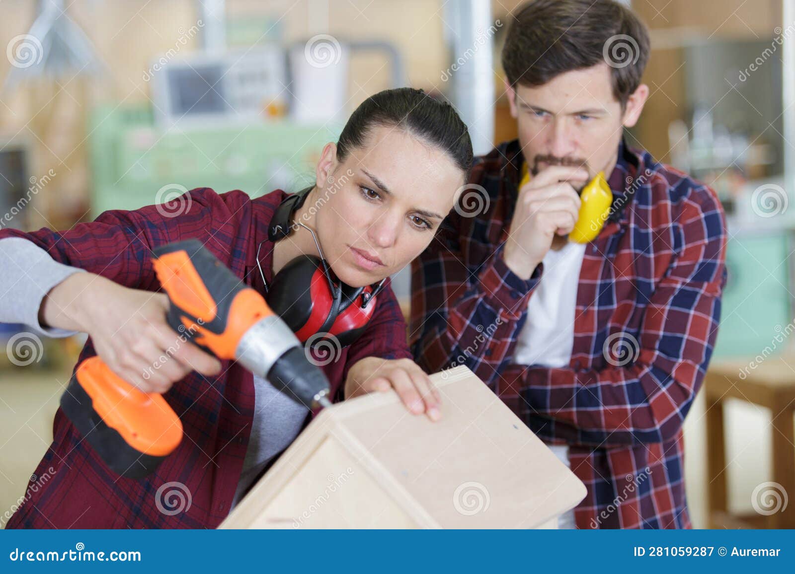 Handyman and Woman Using Power Drill Stock Image - Image of drill ...