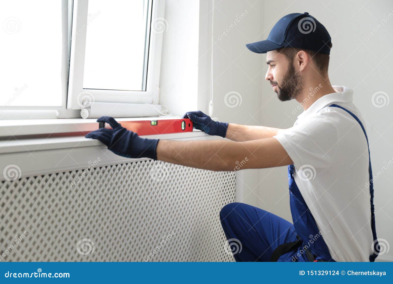 Handyman Working with Building Level. Professional Construction Tools ...