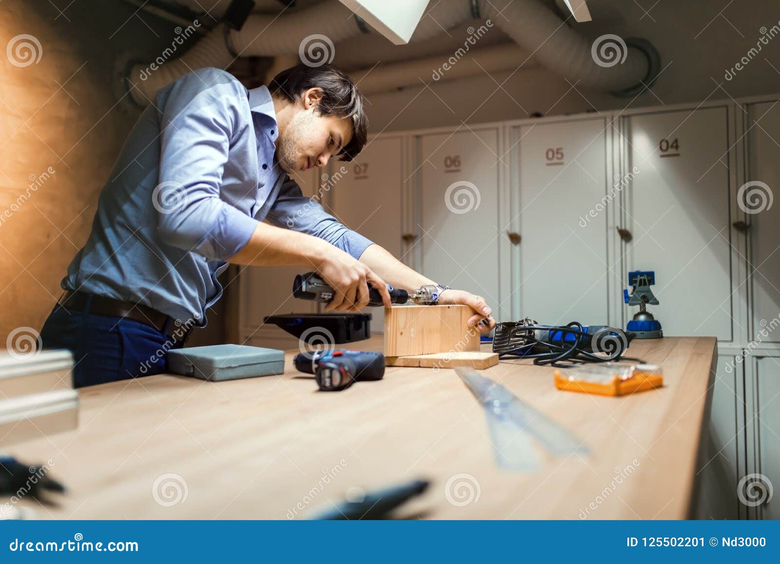 Handyman working with wood stock image. Image of skill - 125502201