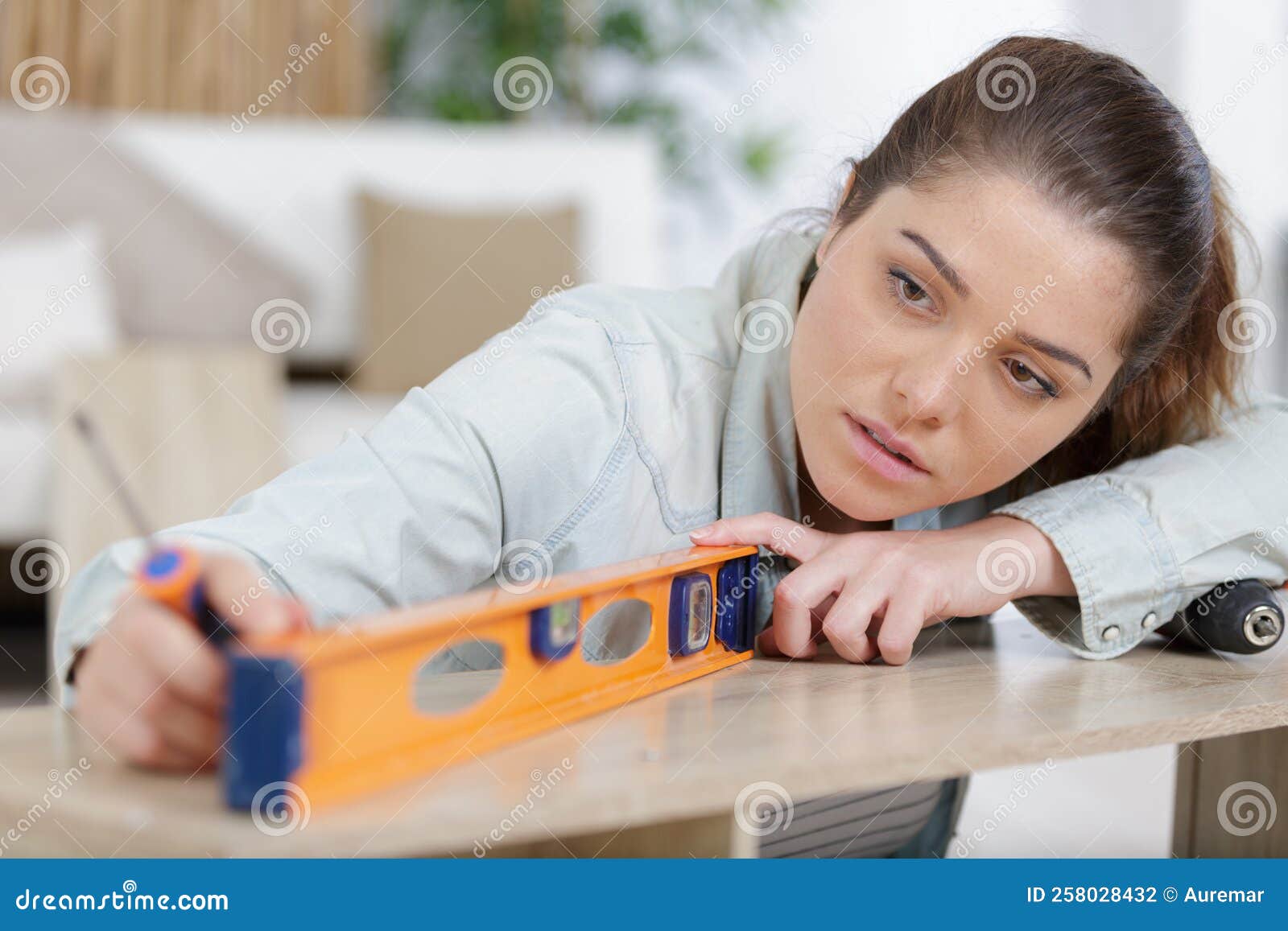 Handywoman Using Measuring Level Stock Photo - Image of adult ...