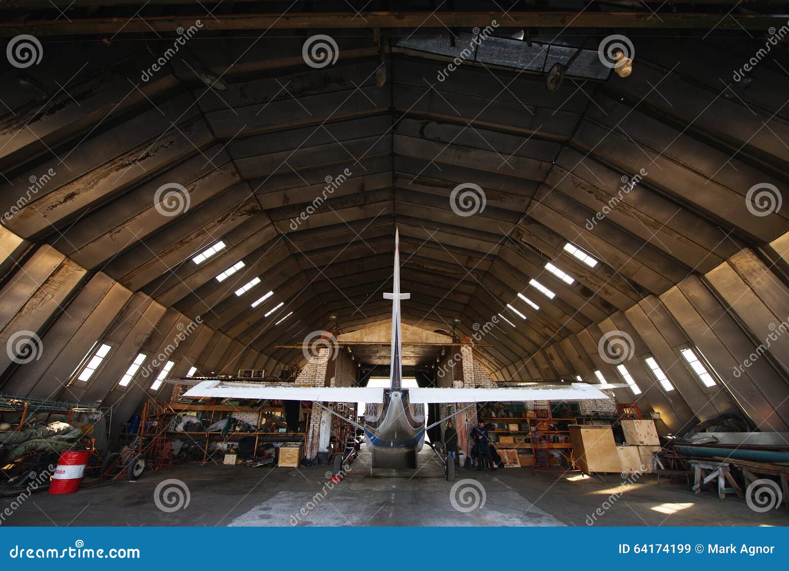 Hangar with Modern Airplane Inside. Editorial Stock Image - Image of ...