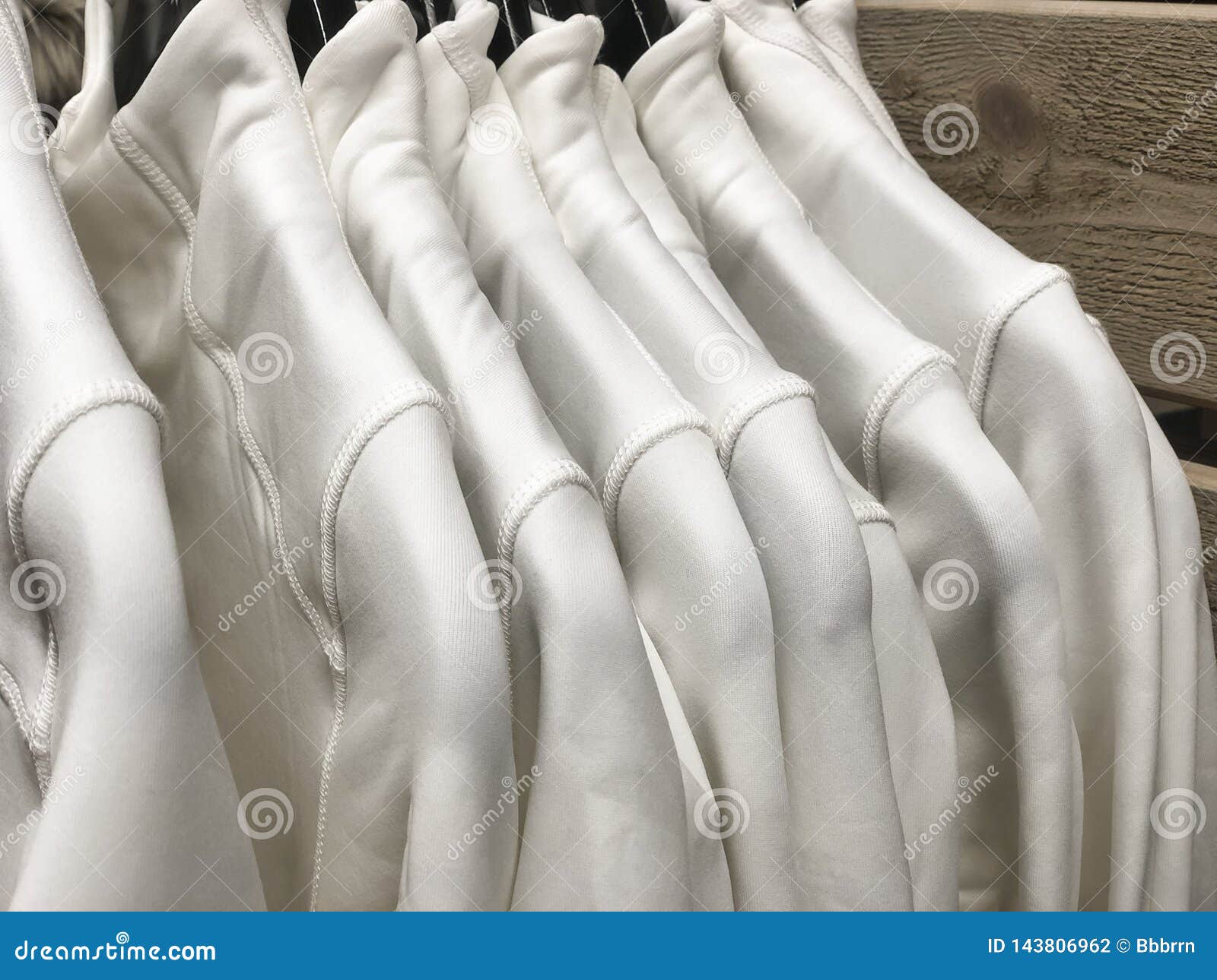 Hanged White Clothes in a Store Display Stock Photo - Image of retail ...