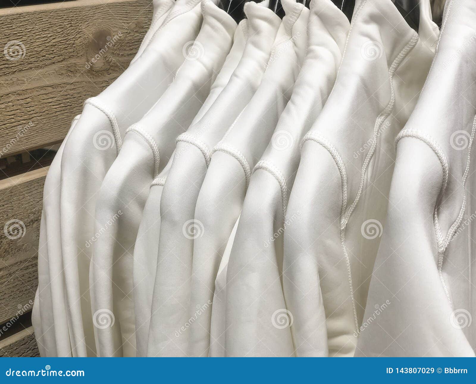 Hanged White Clothes in a Store Display Stock Image - Image of cotton ...