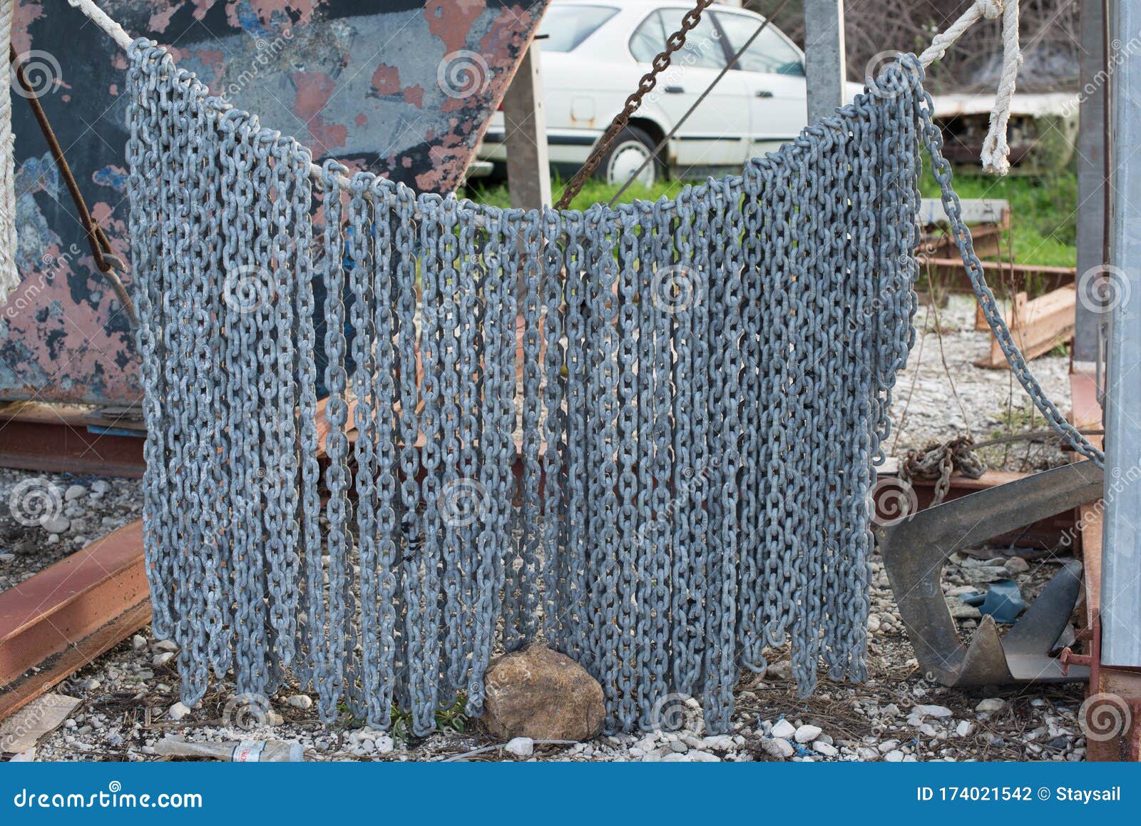 Hanging Anchor Chain from a Sailboat Stock Photo - Image of port ...