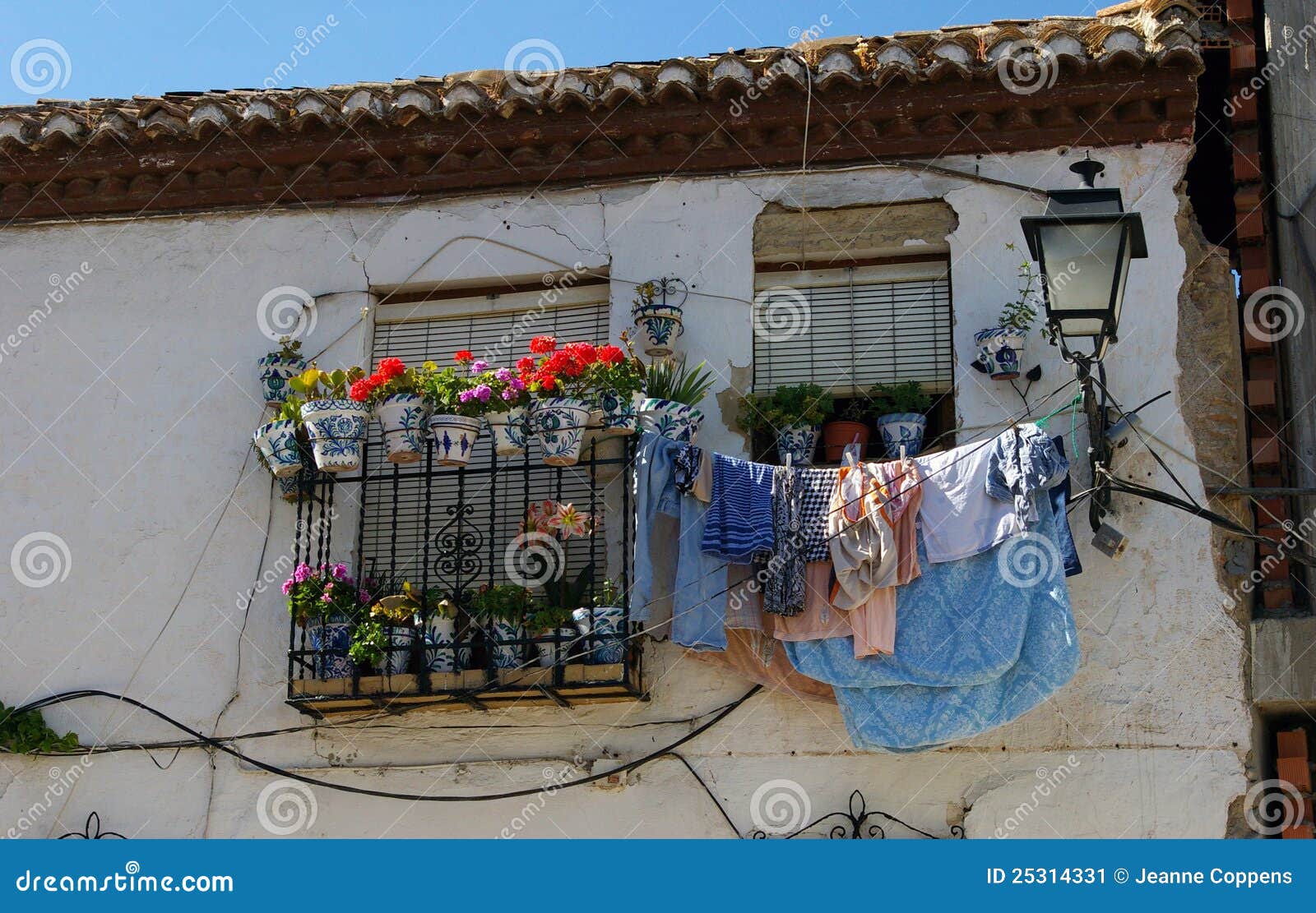 Hanging Clothes and Flowered Balcony. Stock Image - Image of clothes ...