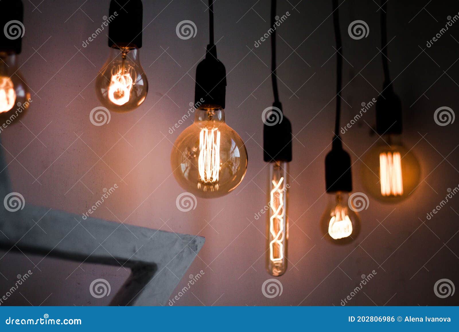 Hanging Edison Light Bulbs on Black Strings Stock Photo - Image of ...