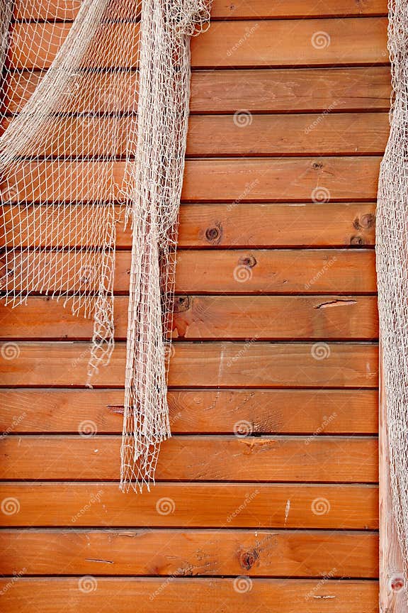 Hanging Fishnet on Wood Wall Stock Image - Image of pattern, brown ...