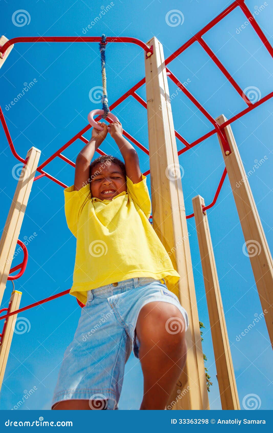 Hanging on gymnastic rings stock photo. Image of child - 33363298