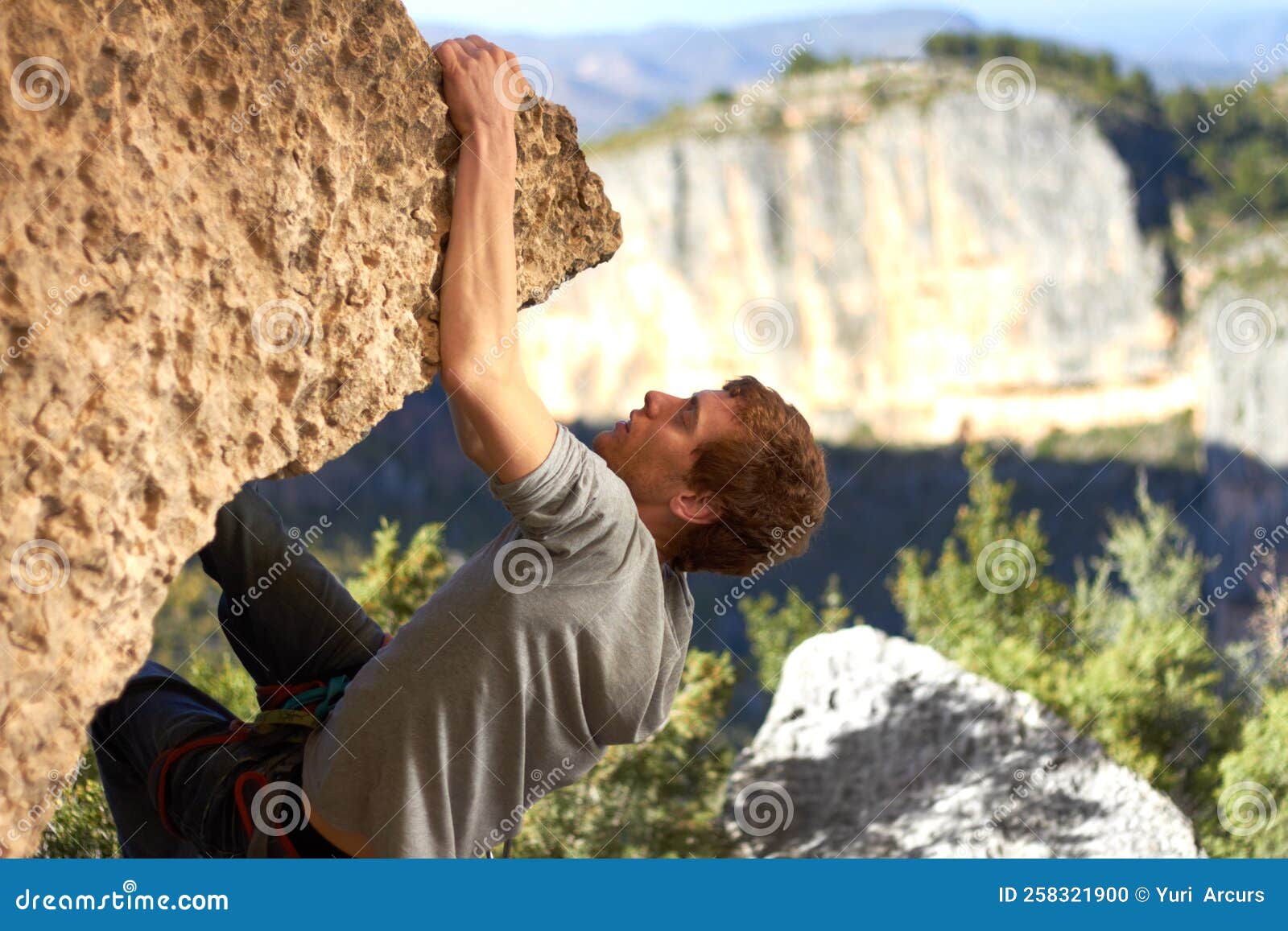 Hanging High. Profile of a Rock Climber Dangling Off the Edge of a ...