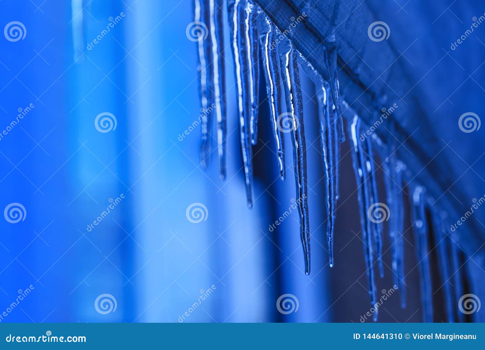 Hanging Icicle during the Spring Time. Melting Icicles with Crystal ...