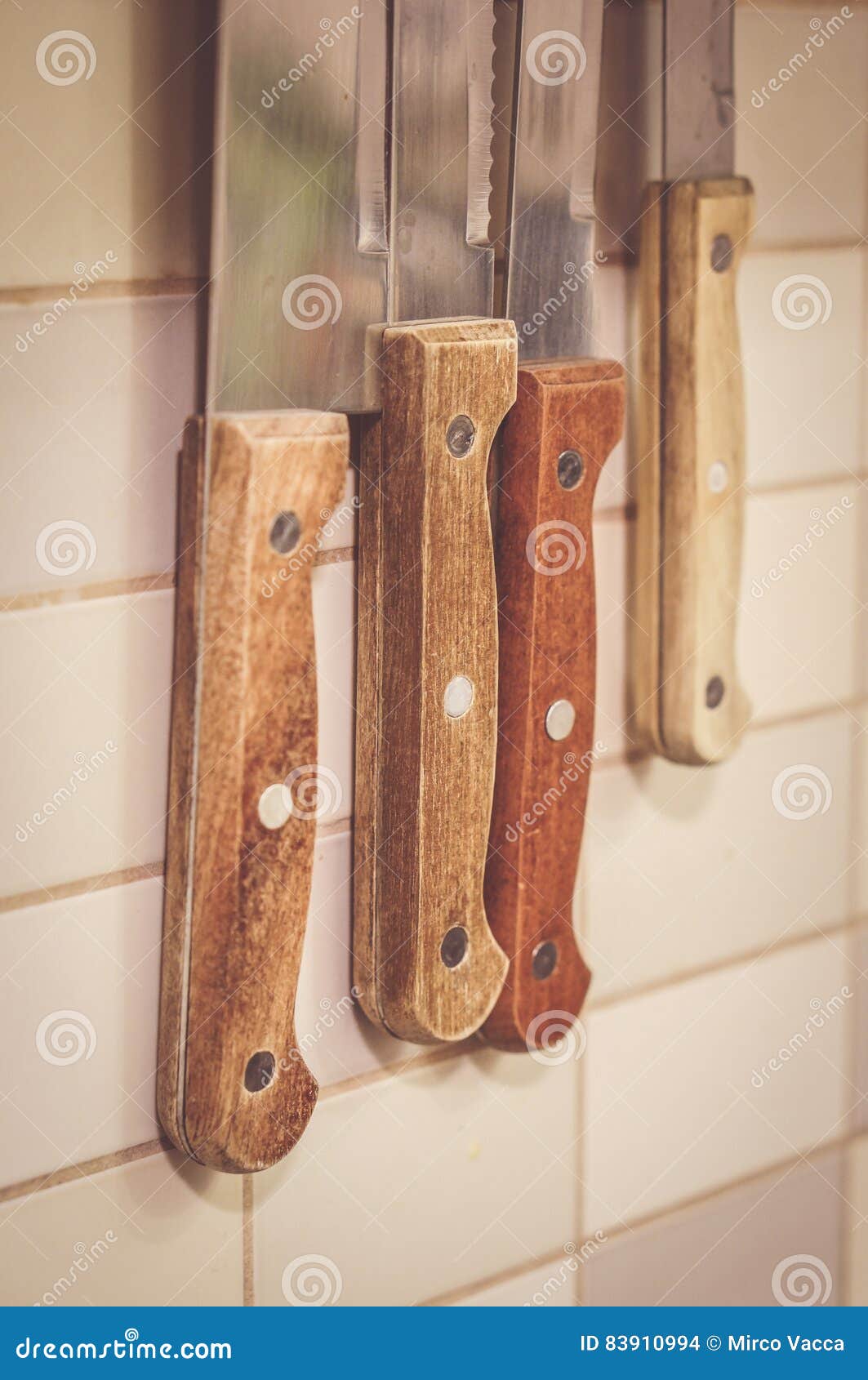 Hanging kitchen knives stock photo. Image of four, wooden - 83910994
