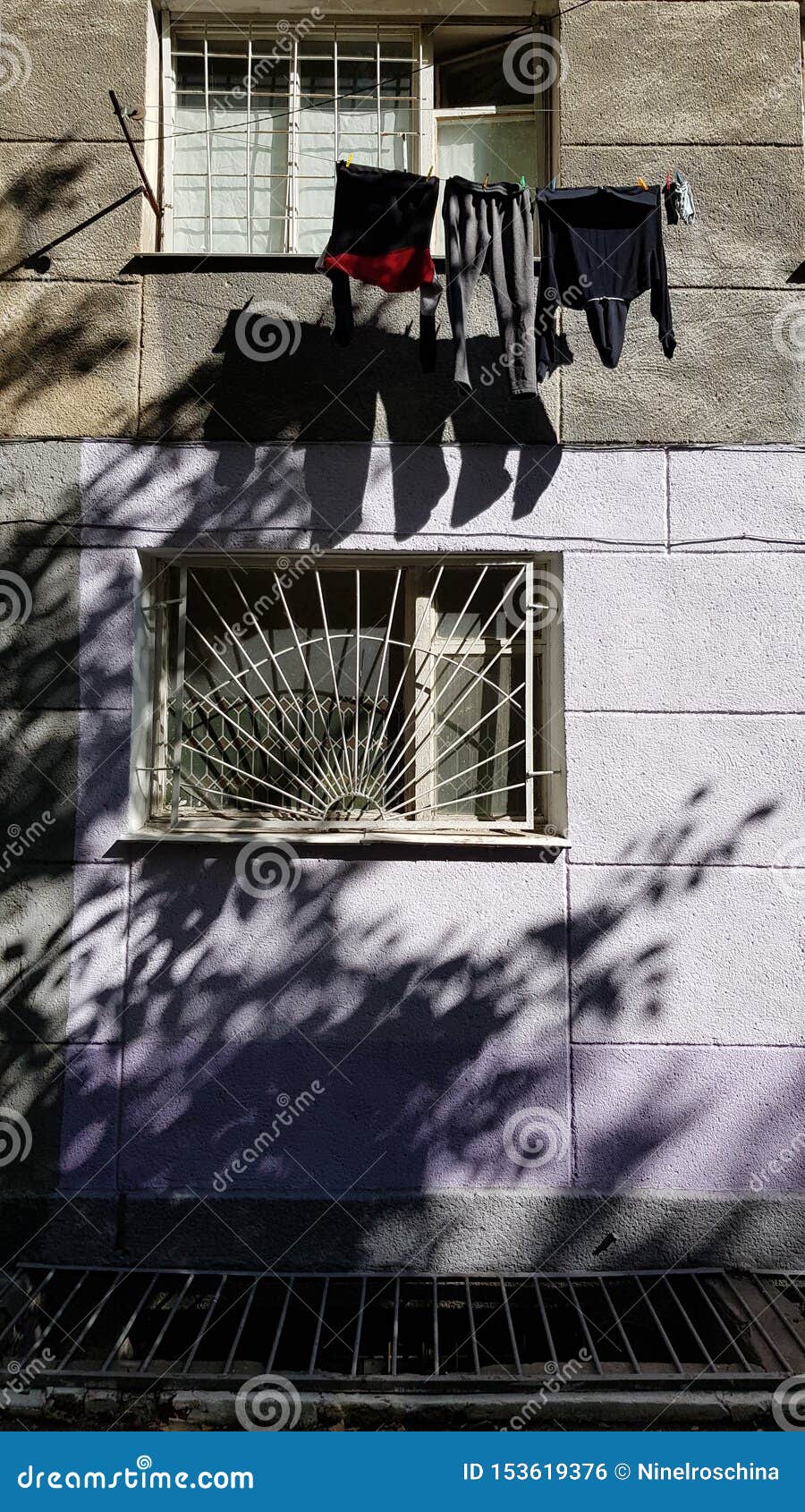 Hanging Laundry is Drying on Rope between Windows Stock Photo - Image ...