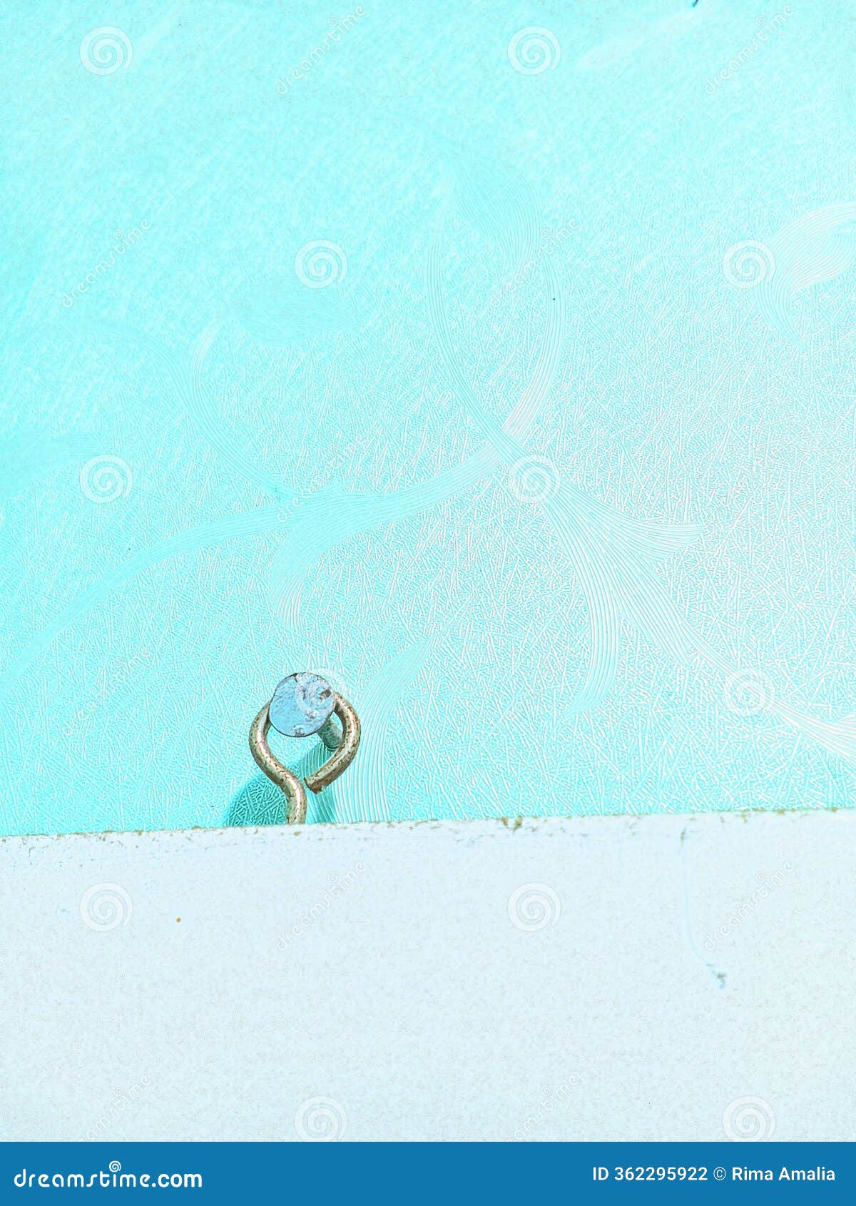 A Hanging Object on Metallic Hook in Textured Background Stock Photo ...
