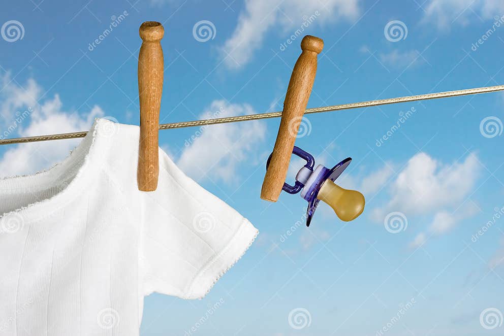 Hanging pacifier stock photo. Image of clothespins, garments - 7384978
