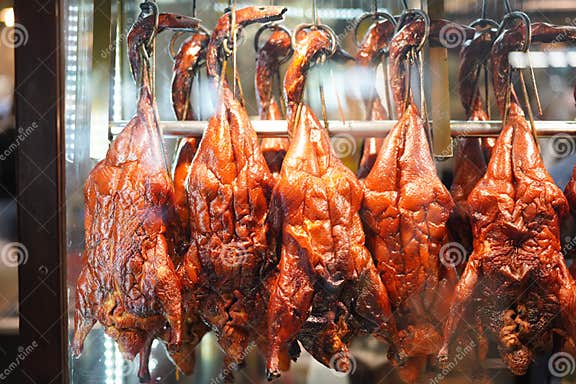 Hanging Roast Ducks on a Rack Stock Photo - Image of food, chickens ...