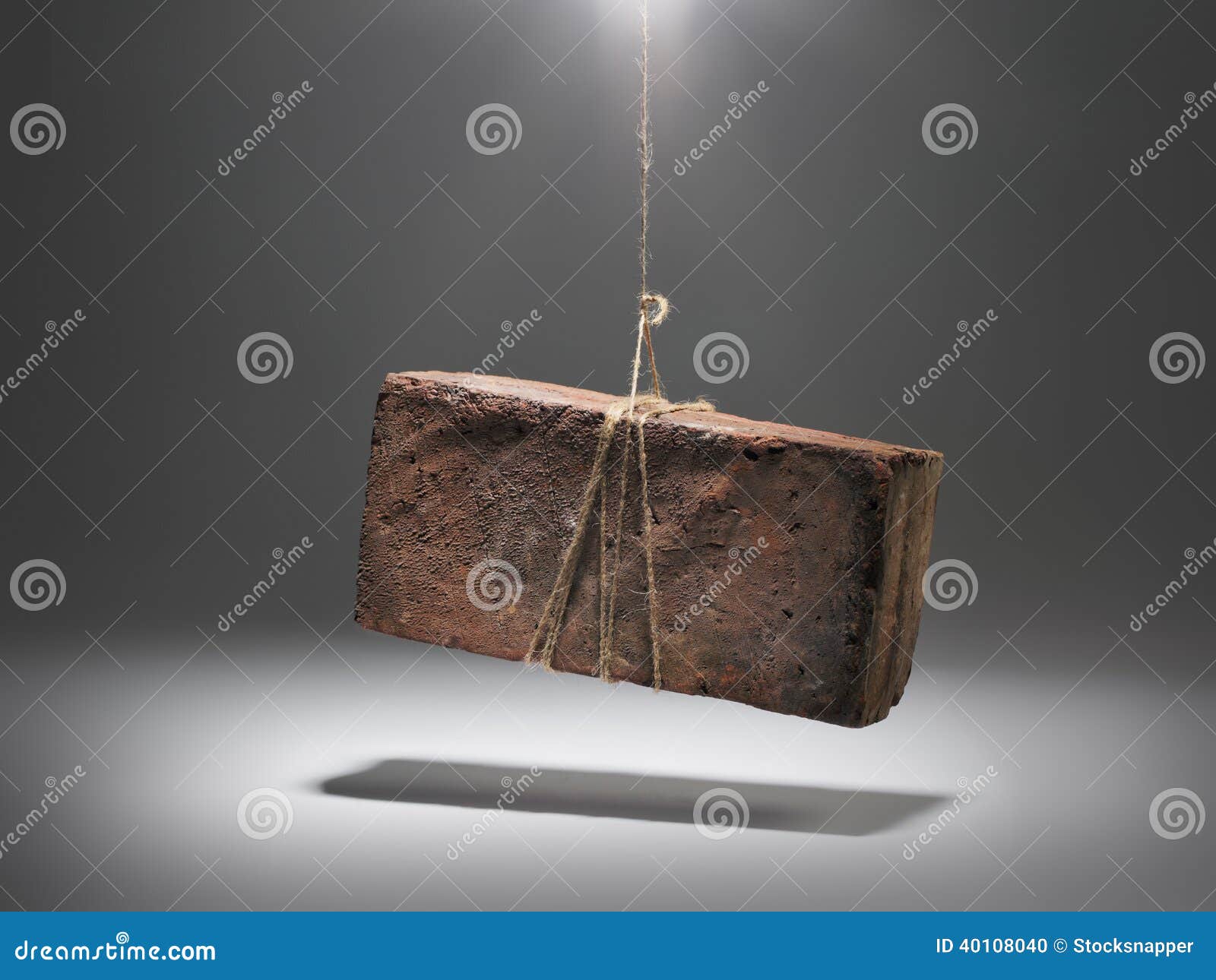 Hanging by a thread stock photo. Image of brick, barely - 40108040