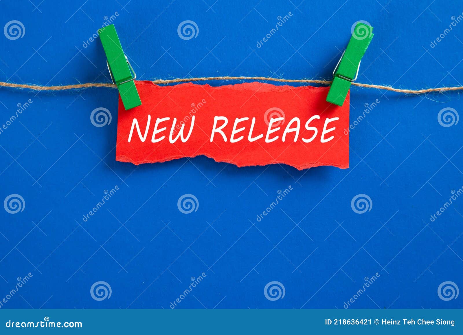 Hanging Torn Paper with New Release Word Stock Image - Image of ...