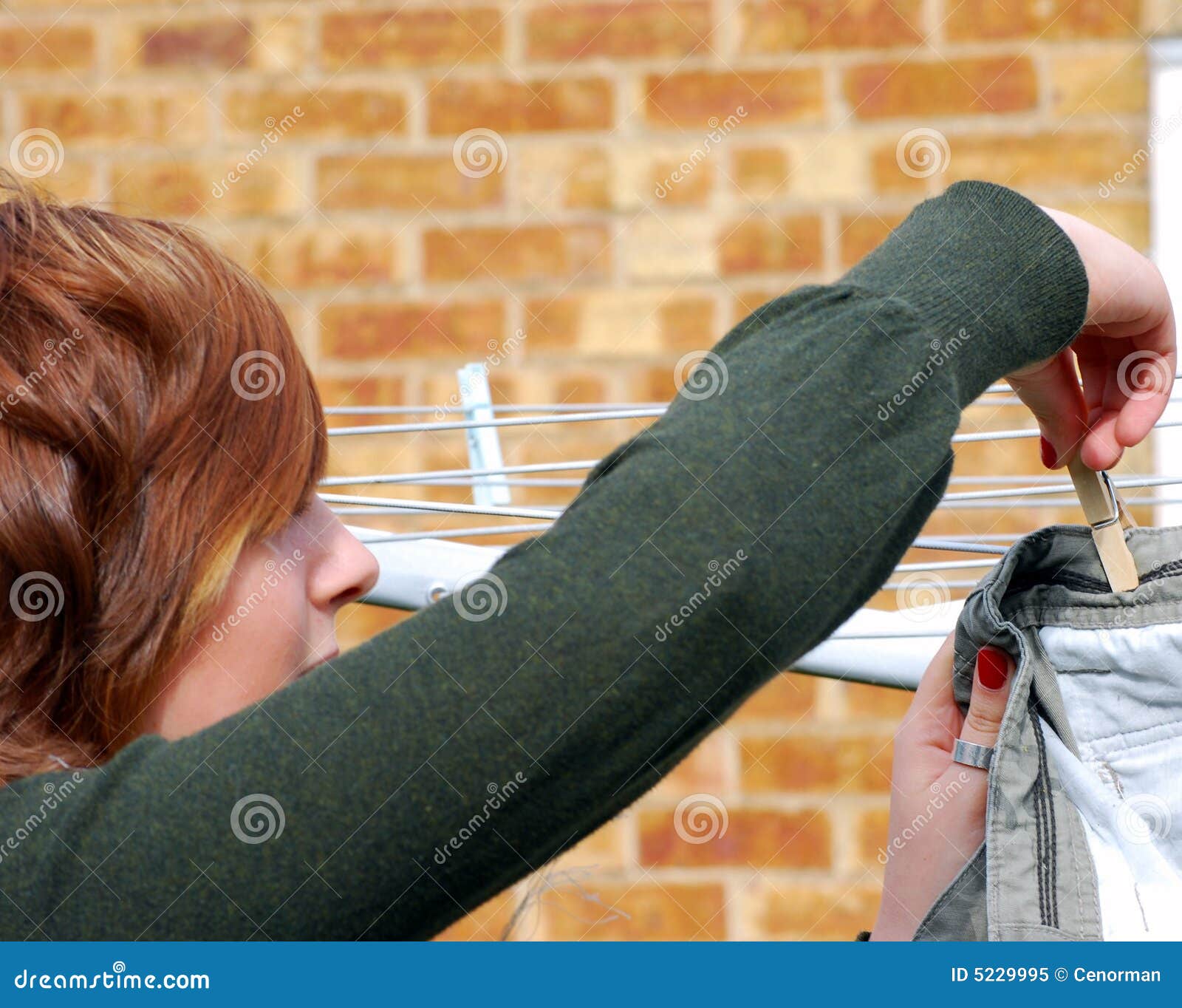 Hanging the washing out stock image. Image of hang, hand - 5229995