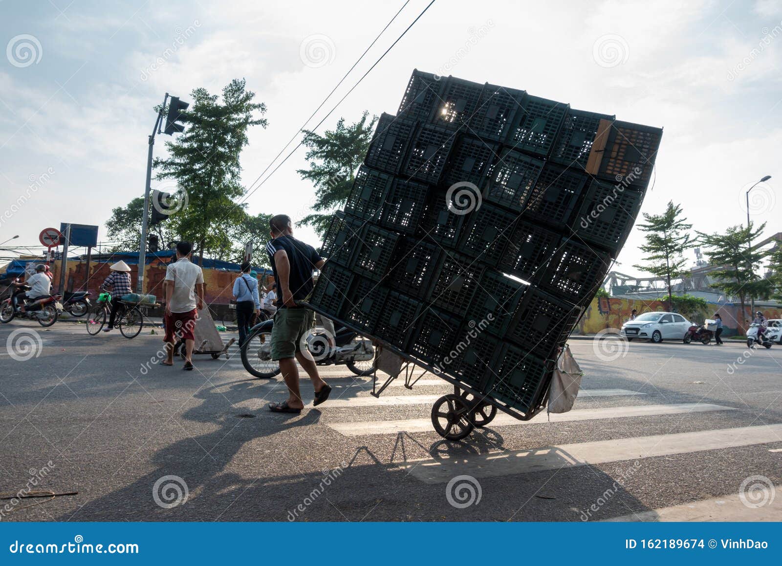Hanoi Street with Worker Pulling Heavy Delivery Cart Editorial Stock ...