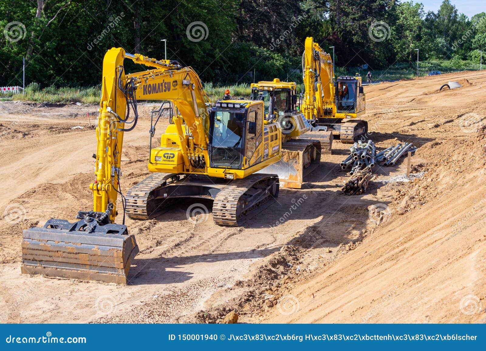 Komatsu Excavator and Other Construction Vehicles Stands on a ...