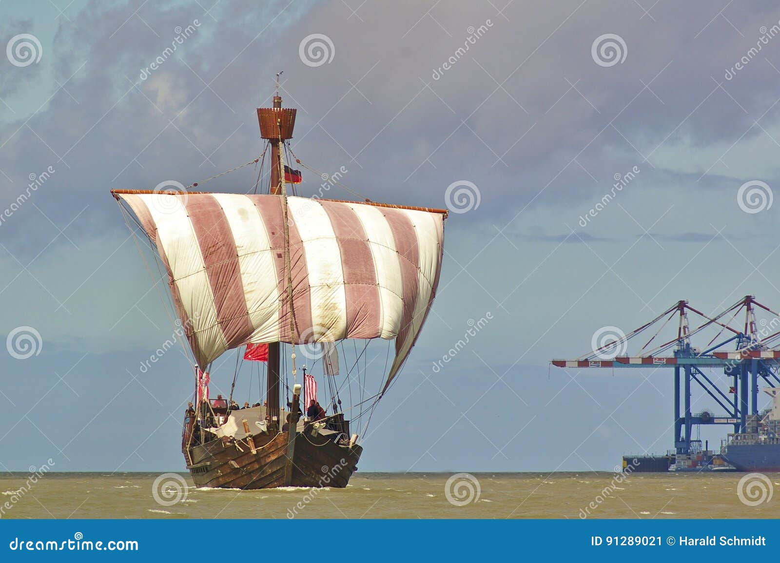 Hanseatic Cog Under Sail with Port Facilities and Cranes Stock Image ...