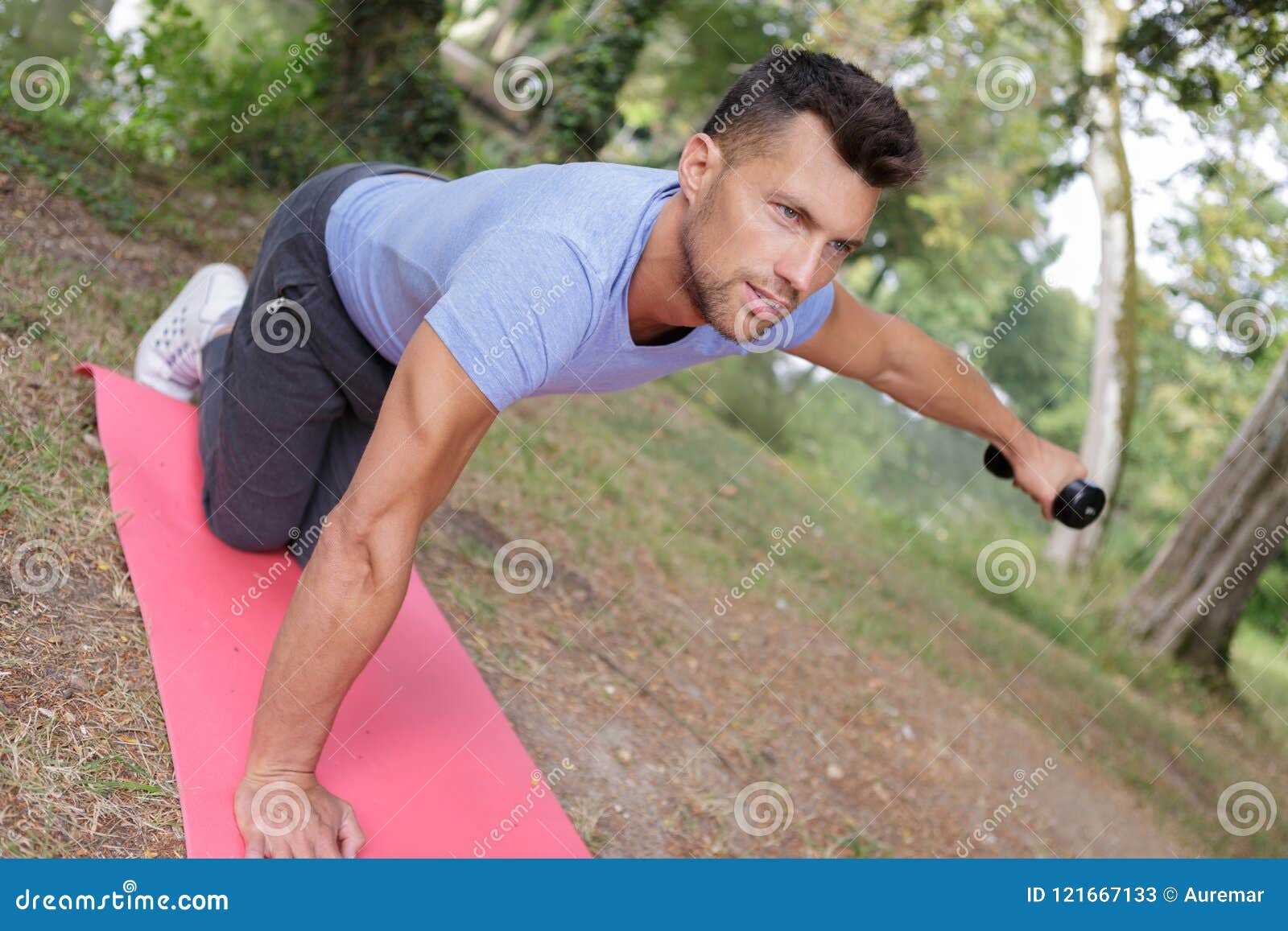 Hansome Man Making Exercises on Mat Outdoors Stock Image - Image of ...