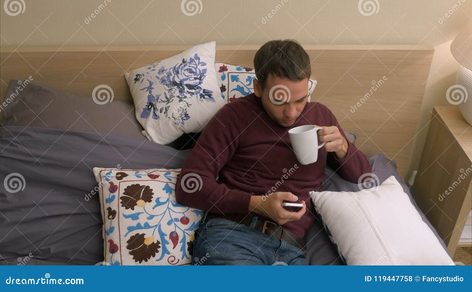 Hansome Man Using Smart Phone while Lying in Bed at Night Stock Photo ...
