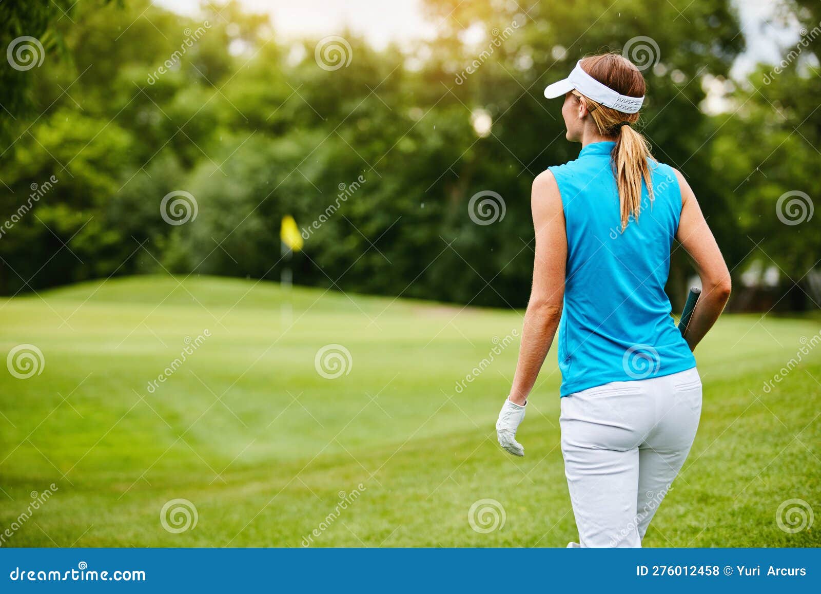 Happiness is a Long Walk with the Putter. a Woman on a Golf Course ...