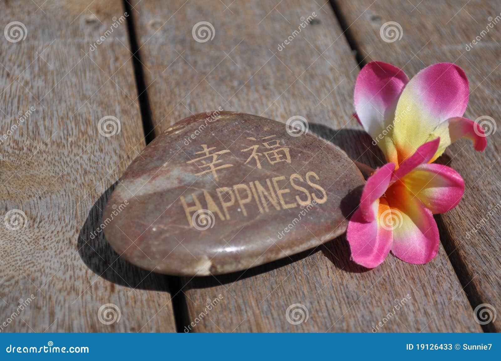 Happiness Wish Stone with Frangipani Flowers Stock Image - Image of ...