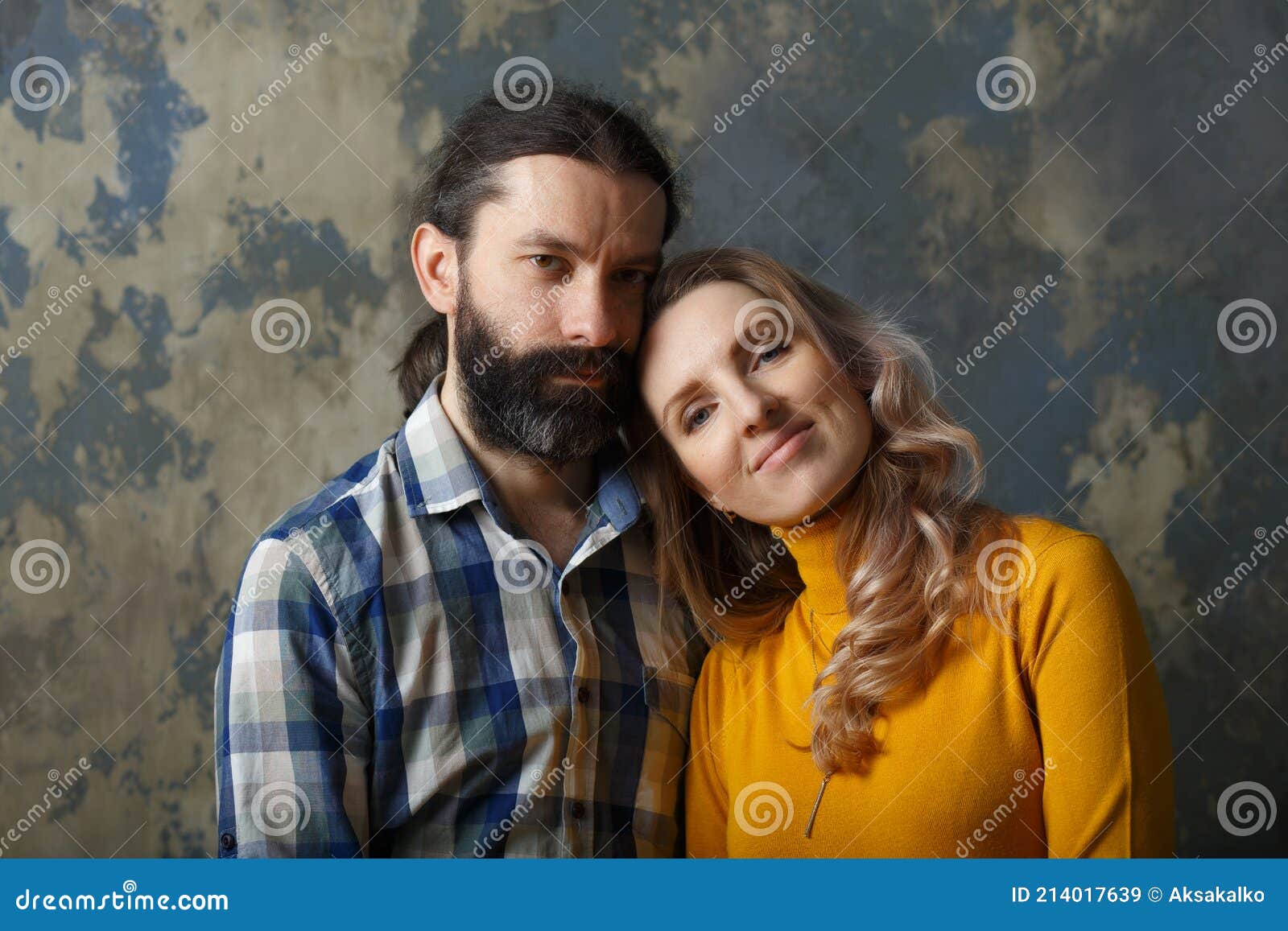 Happy Adult Couple Hugging Smiling Wide And Looking At Camera Stock