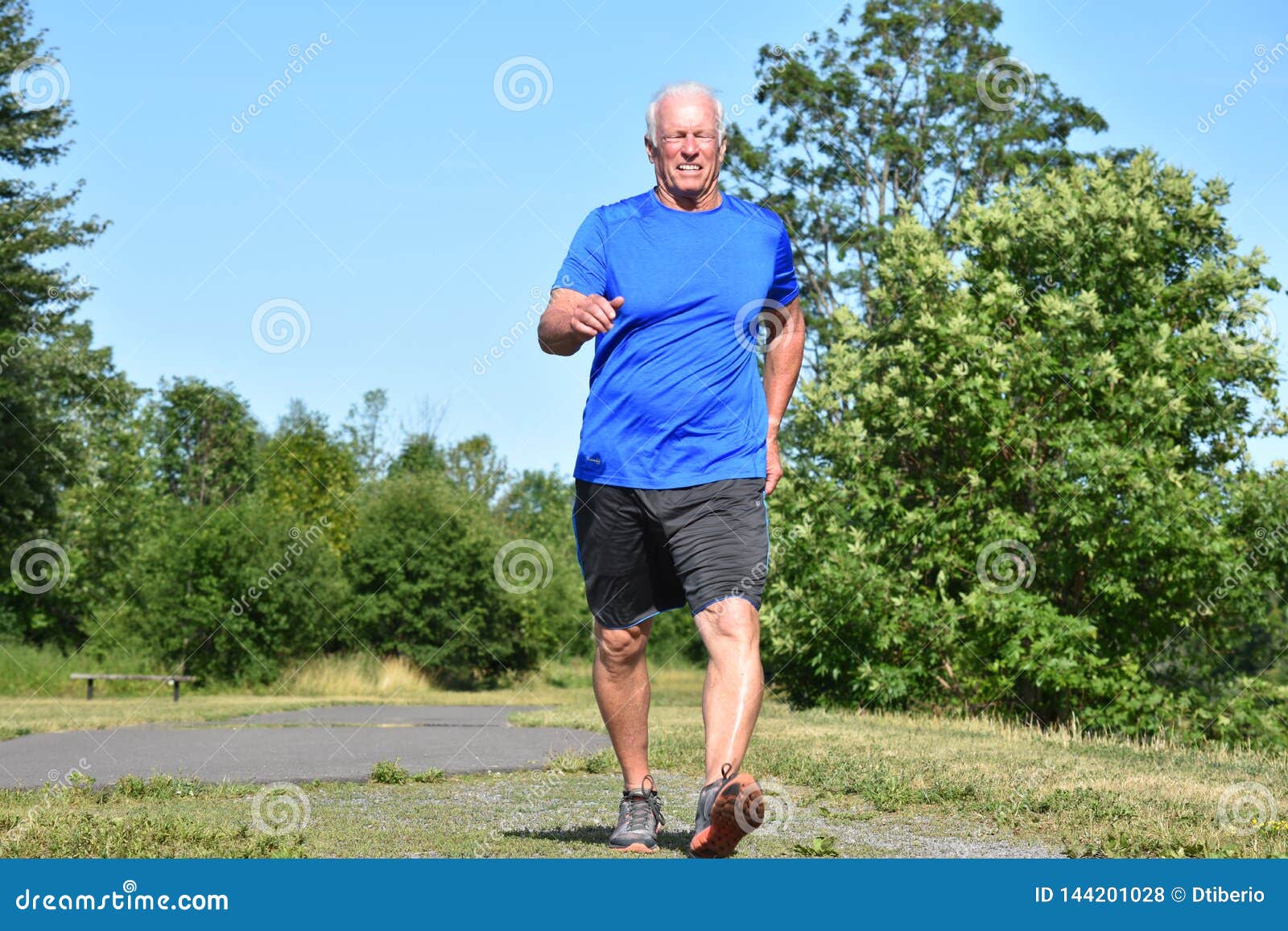 Happy Adult Male Walking stock photo. Image of mature - 144201028