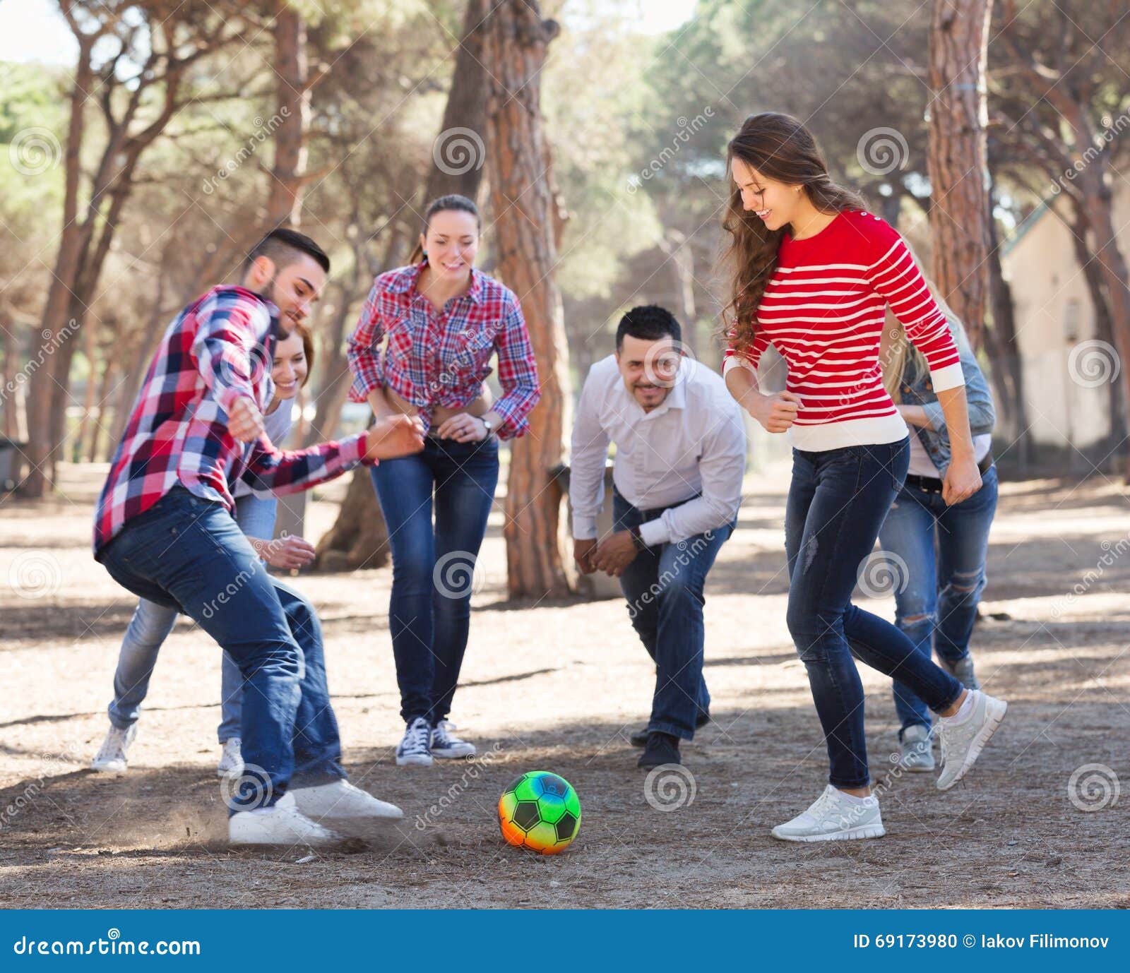 Happy Adults Chasing Ball Outdoors Stock Photo - Image of friends ...