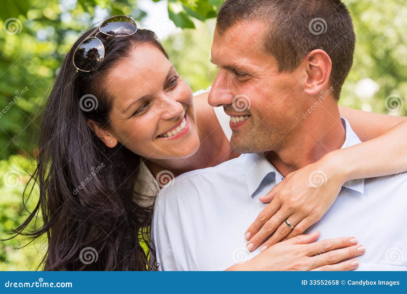 Happy Affectionate Young Couple Hugging in Park Stock Photo - Image of ...