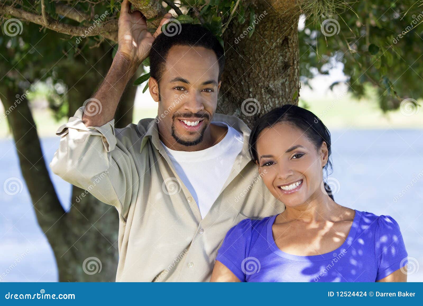 Happy African American Couple Under a Tree Stock Photo - Image of black ...