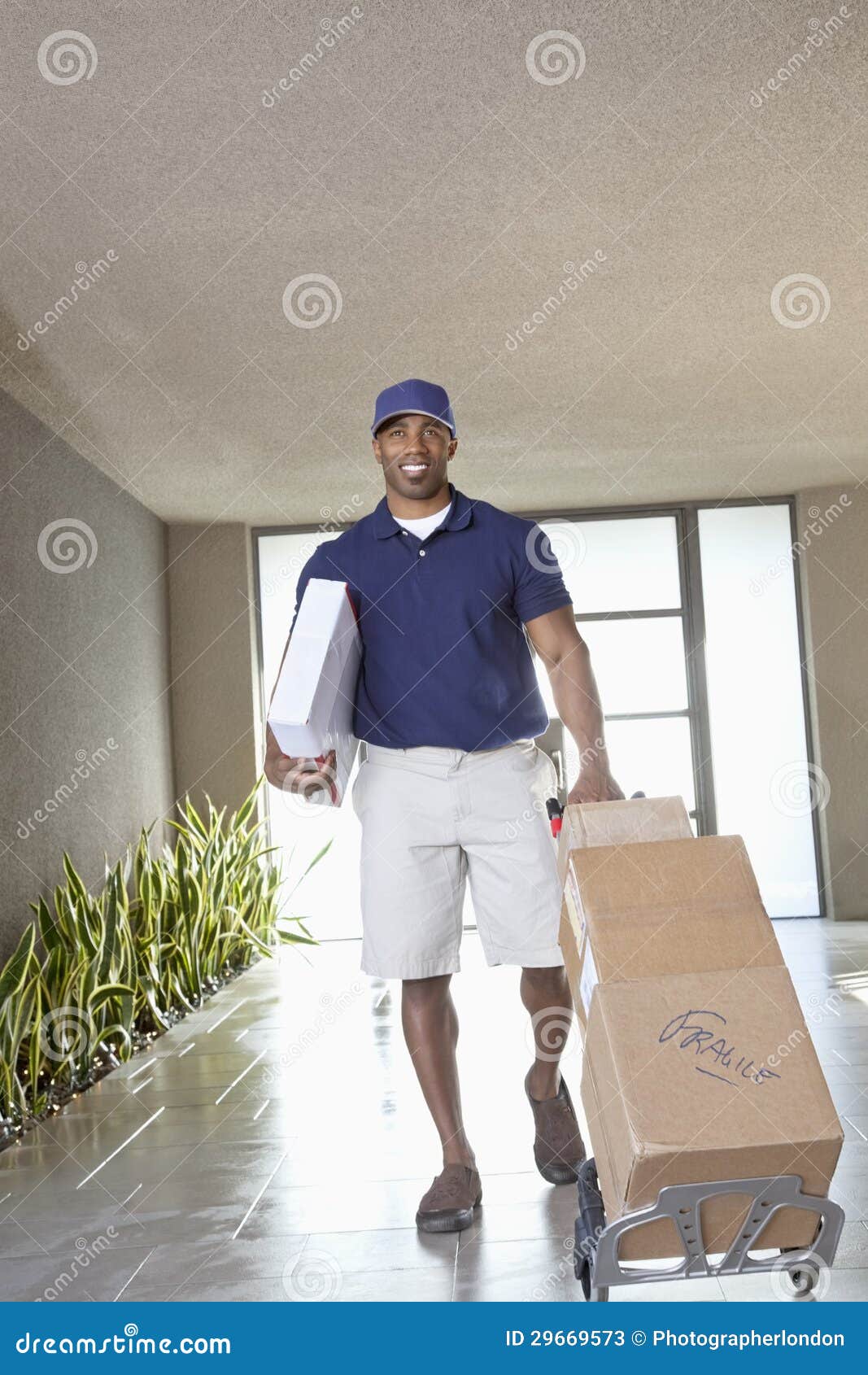 Happy African American Delivery Man with Packages Stock Image - Image ...