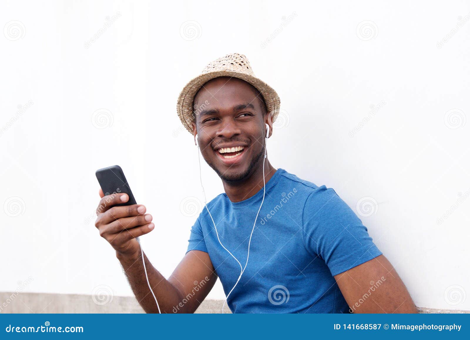 Happy African American Man Listening To Music With Smart Phone And