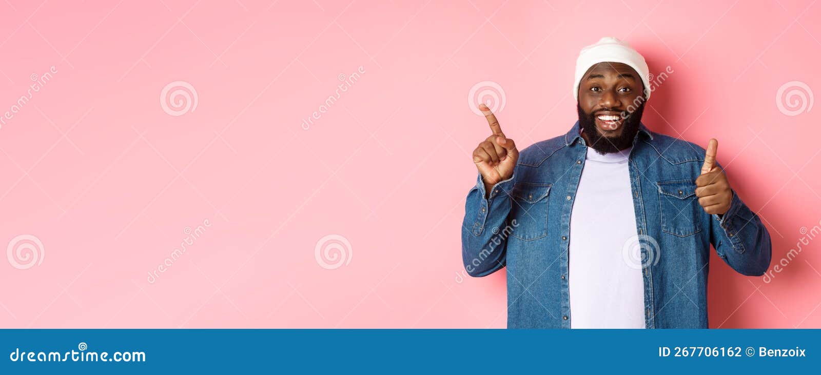 Happy African American Man Showing Thumb Up And Pointing At Upper Left