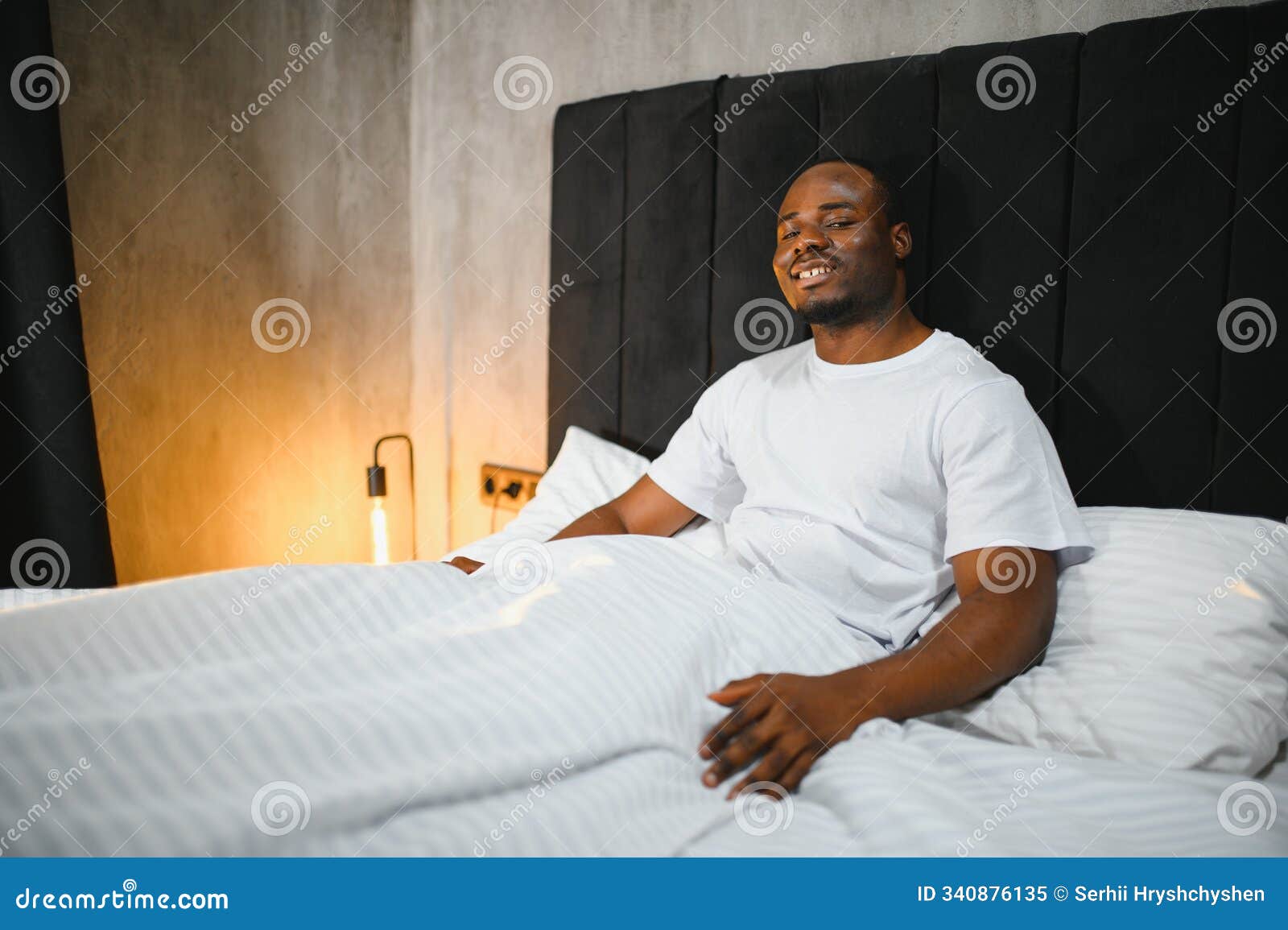 Happy African American Man Waking Up in Bed Stock Image - Image of ...