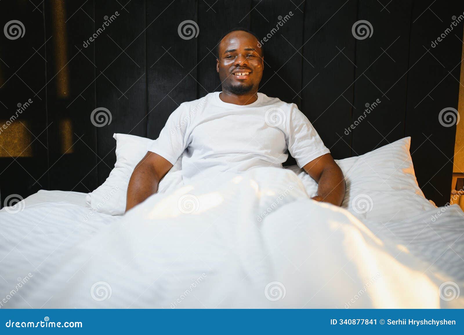 Happy African American Man Waking Up in Bed Stock Image - Image of male ...