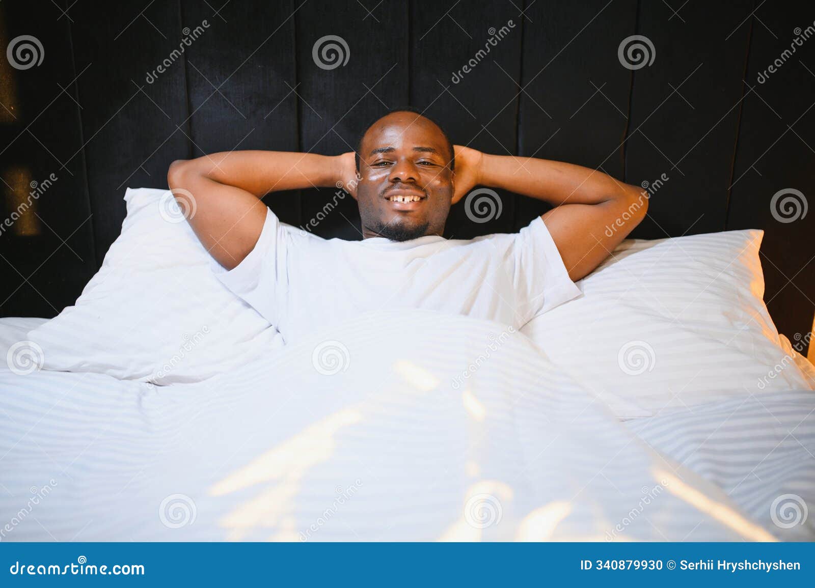 Happy African American Man Waking Up in Bed Stock Photo - Image of face ...