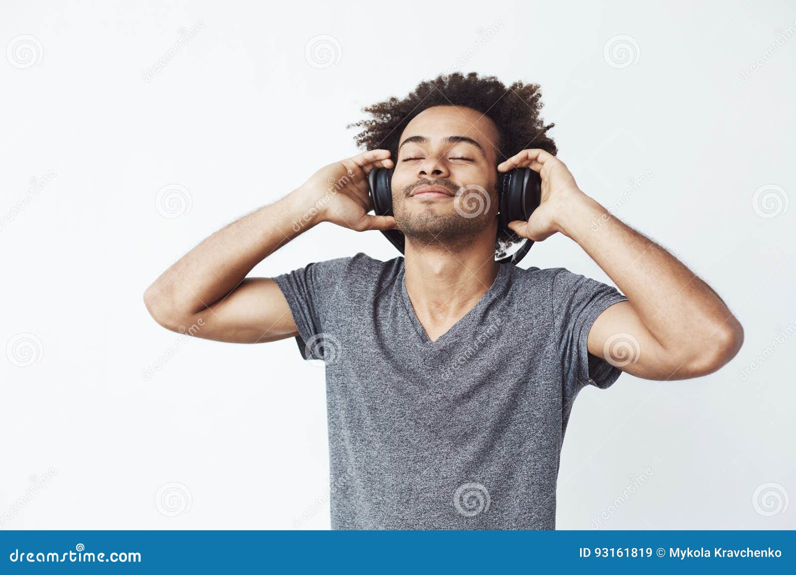 Happy African Man Smiling Listening To Music In Headphones Closed Eyes