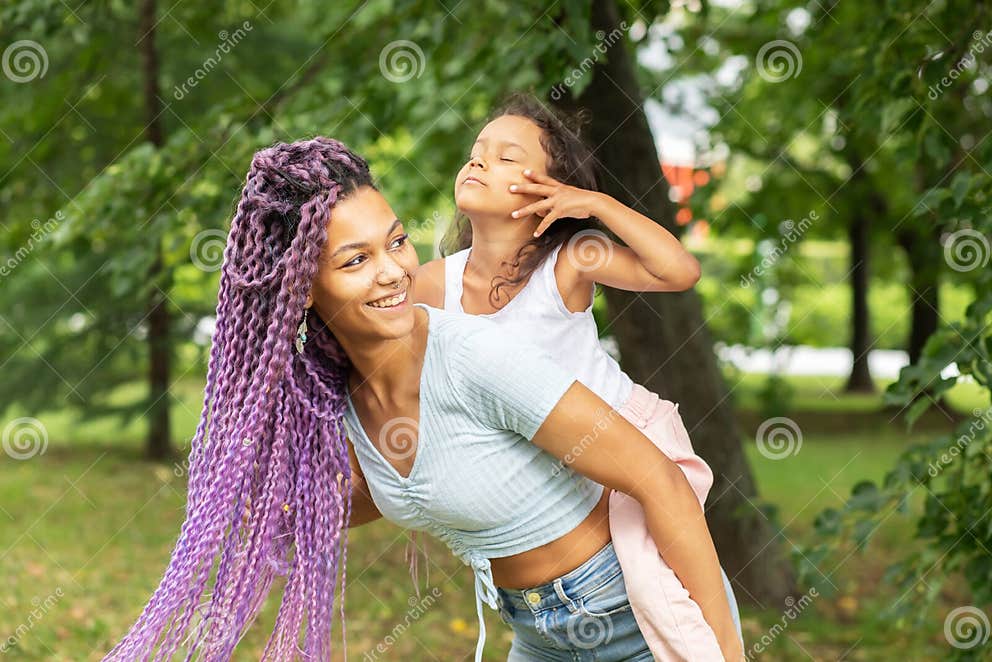 Happy African Young Mother with Afro Braids with Her Daughter Having ... Happy African Young Mother with Afro Braids with Her Daughter Having ...