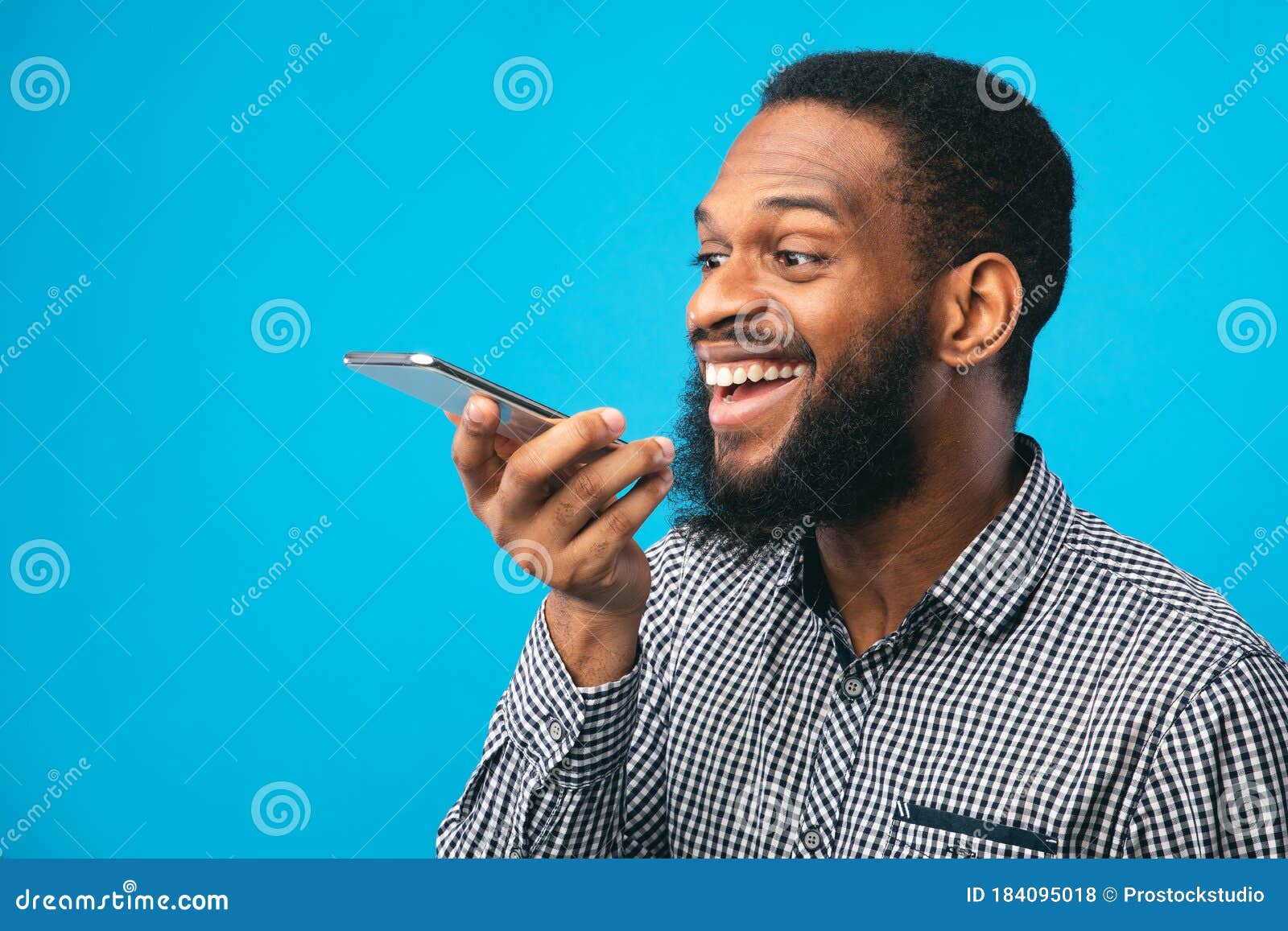 Happy Afro Man Using Voice Assistant on Smartphone Stock Photo - Image ...