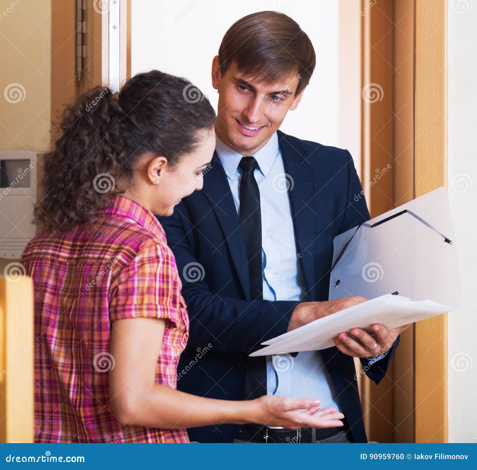 Happy agent with documents stock photo. Image of home - 90959760