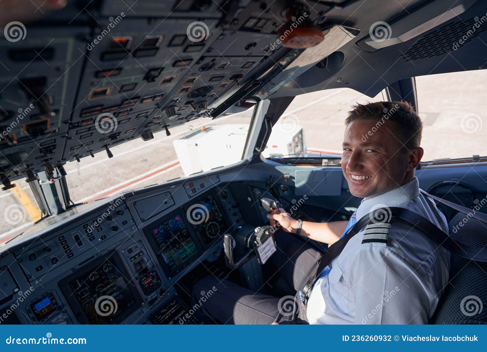Happy Airplane Pilot Smiling To Camera with Hand on Wheel Stock Photo ...