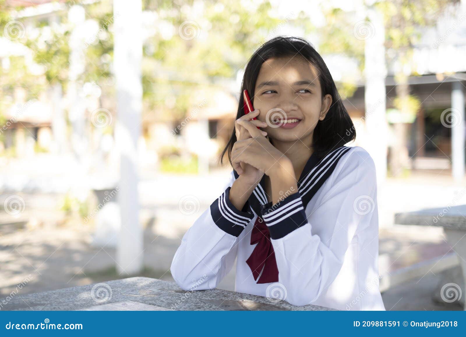 Happy Asain Student Use Smart Phone and Sitting at School Stock Image ...