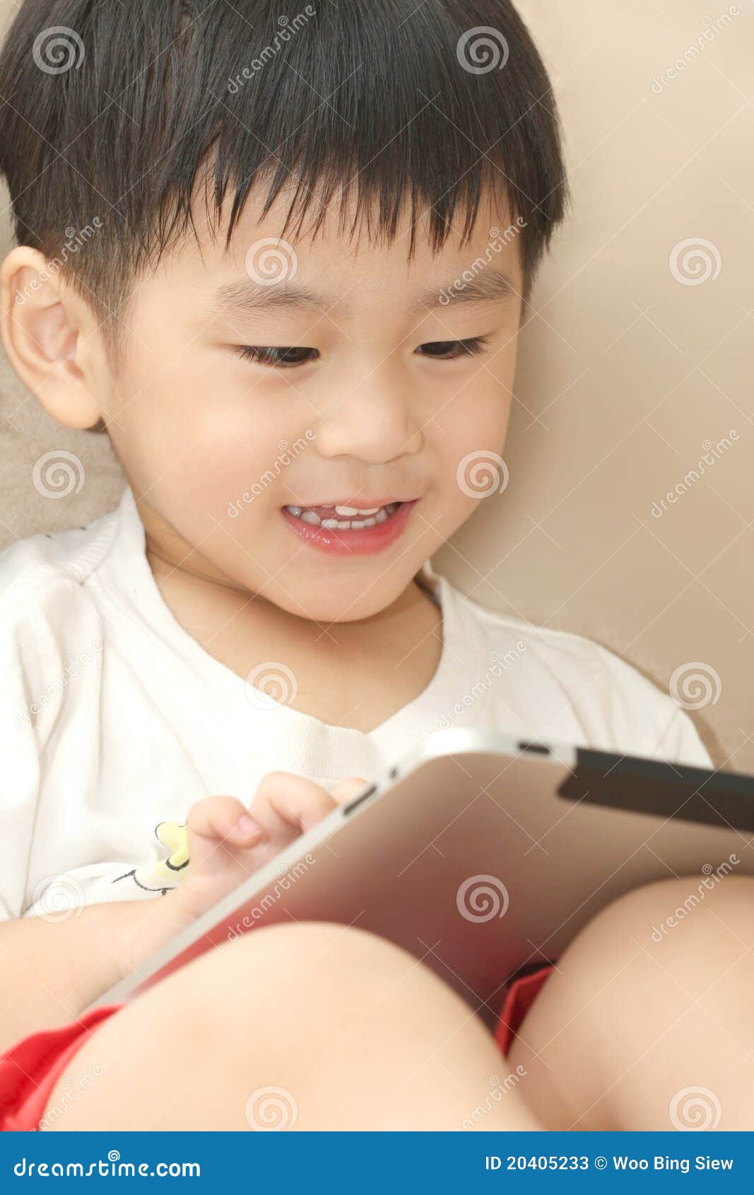 Happy Asian Boy Playing IPad Stock Image - Image of ipad, happy: 20405233