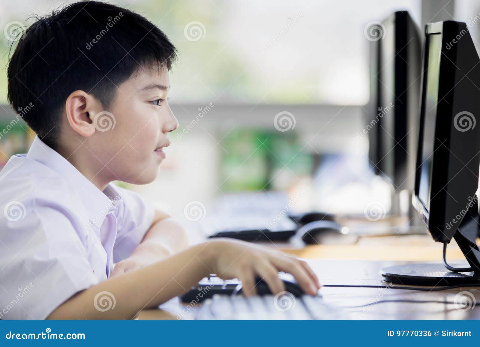 Happy Asian Boy in Student Uniform Using Computer at School . Stock ...